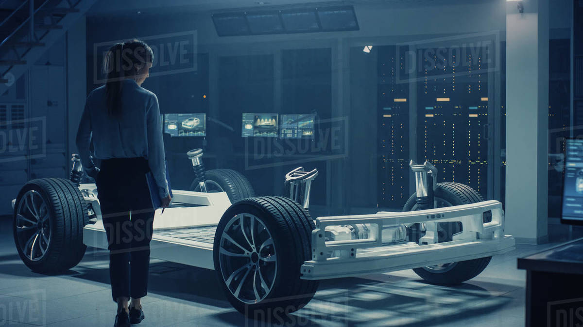 Automobile Female Engineer Working on Electric Car Chassis Prototype ...