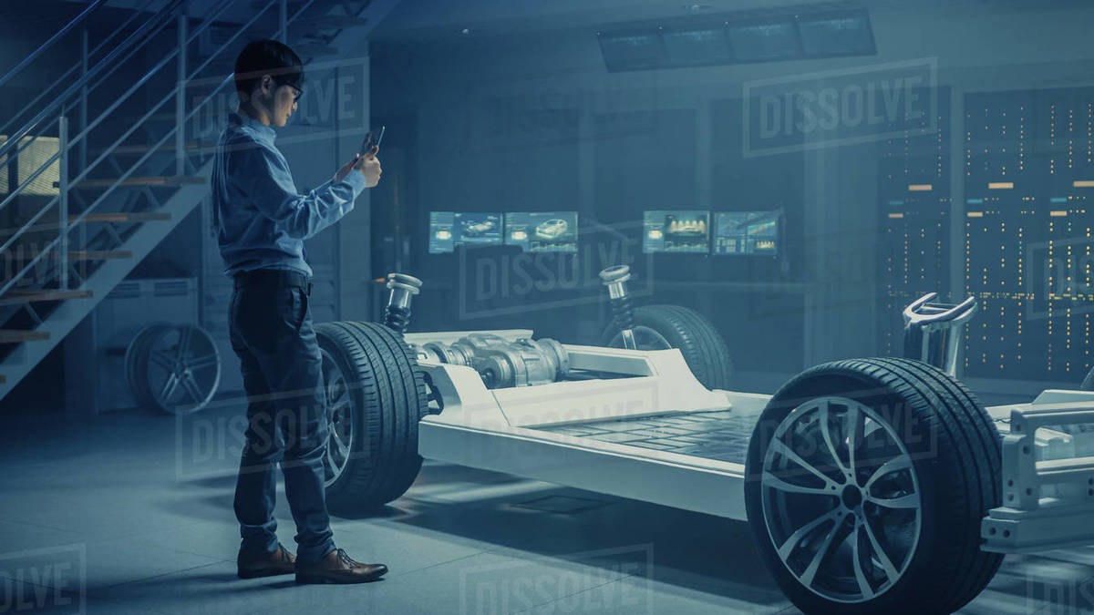 Automobile Engineer Working on Electric Car Chassis Platform, Using ...