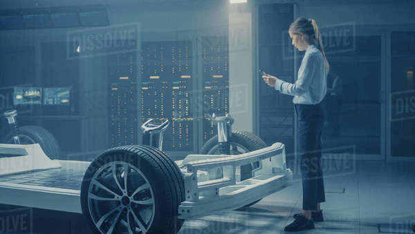 Automobile Engineer Working on Electric Car Chassis Platform, Using ...