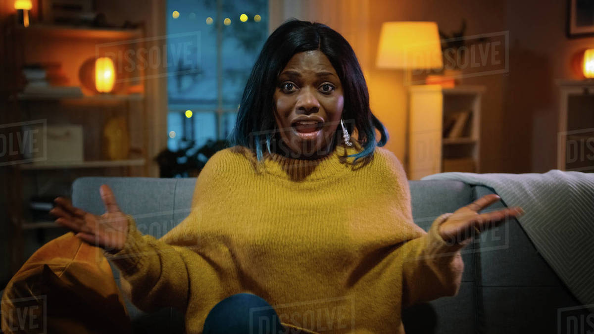 Portrait of a Beautiful Black Girl Sitting on a Couch at Home at Night ...