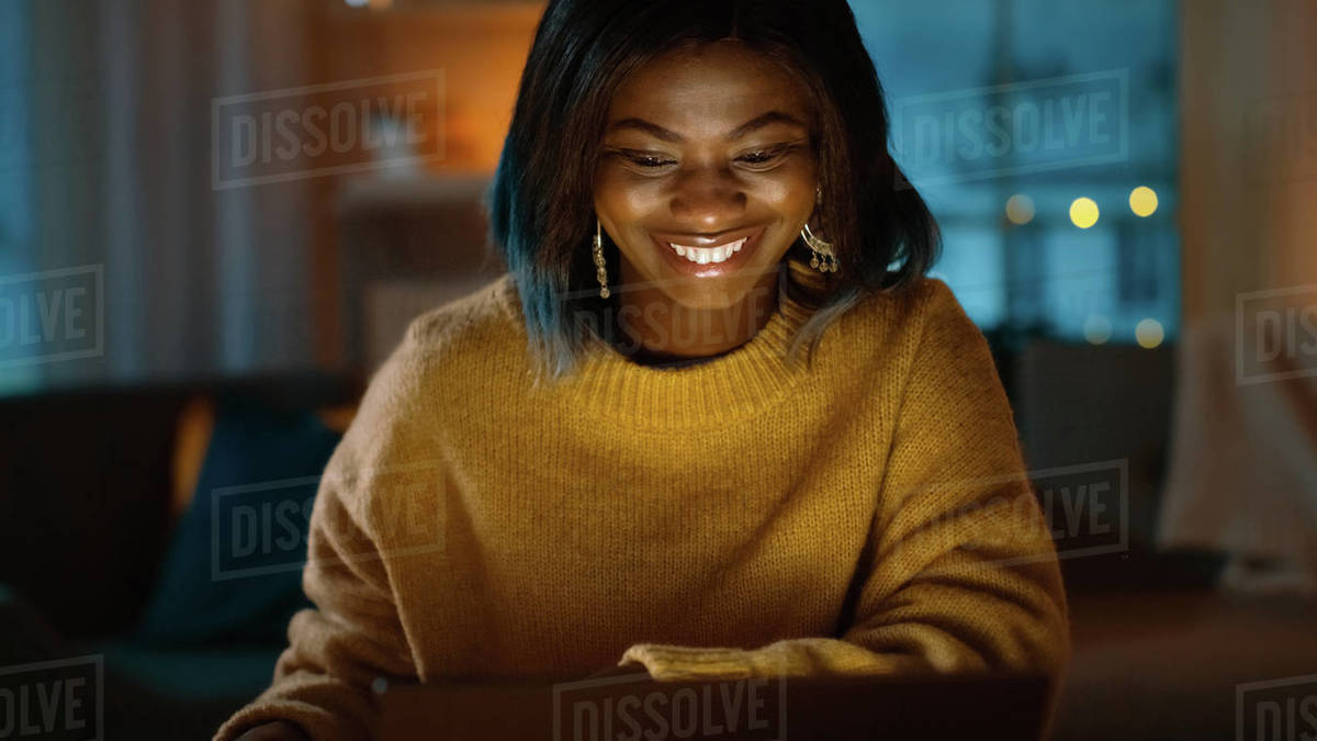 Portrait of Beautiful Black Girl Uses Laptop while Sitting at Her Desk ...