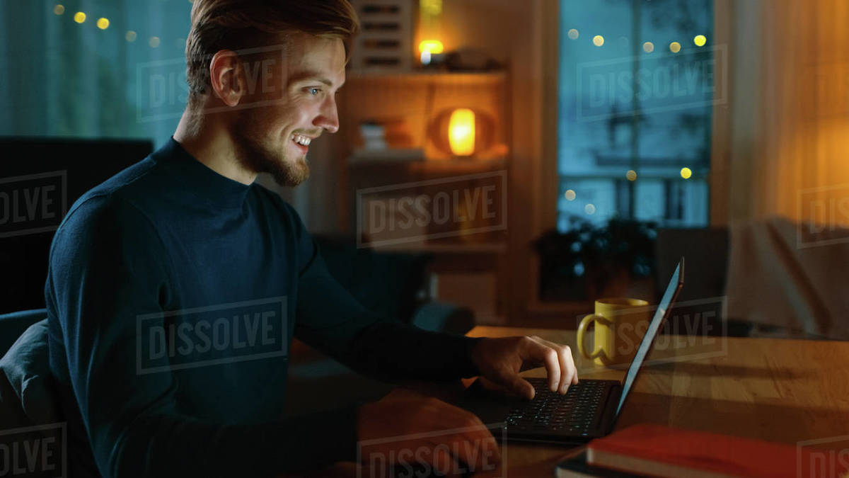 Evening at Home: Portrait of Handsome Man Sitting at His Desk Working ...