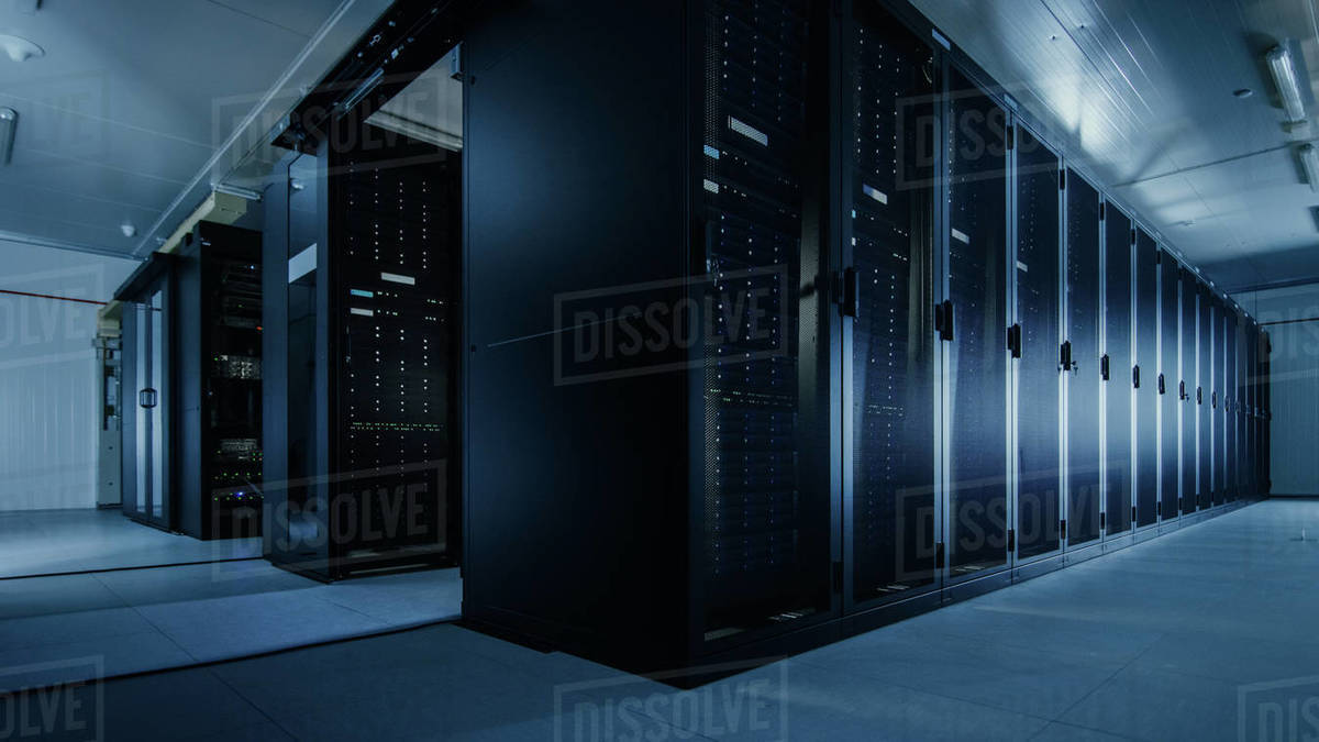 Shot of a Working Data Center With Rows of Rack Servers. Led Lights Blinking and Computers are ...