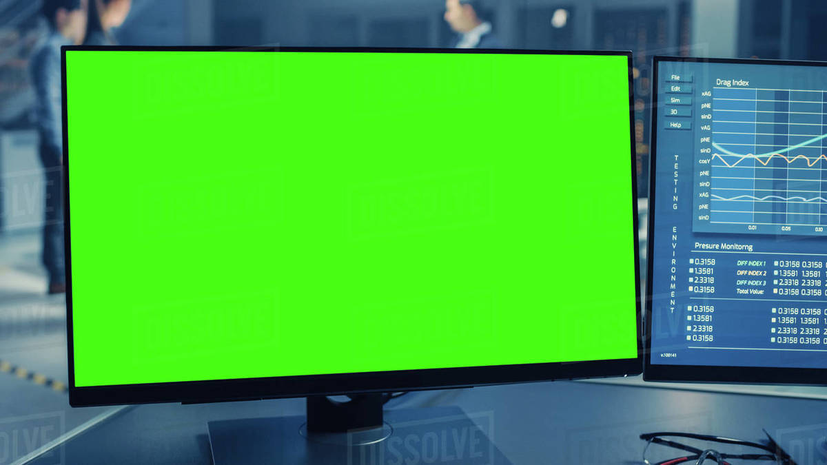 Professional Engineer Works on a Computer with Green Screen Mock Up and ...