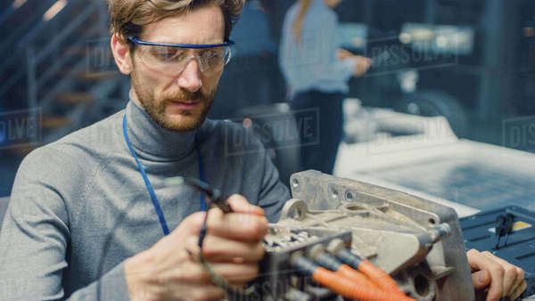 Professional Automotive Engineer in Glasses with a Computer and ...