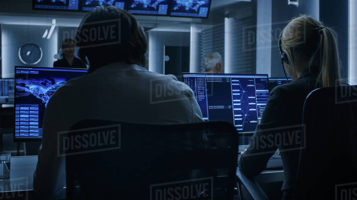 Back View of the Cyber Security Dispatchers Working on Personal ...