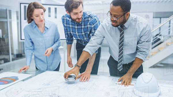 In the Industrial Engineering Facility: Diverse Group of Engineers and ...