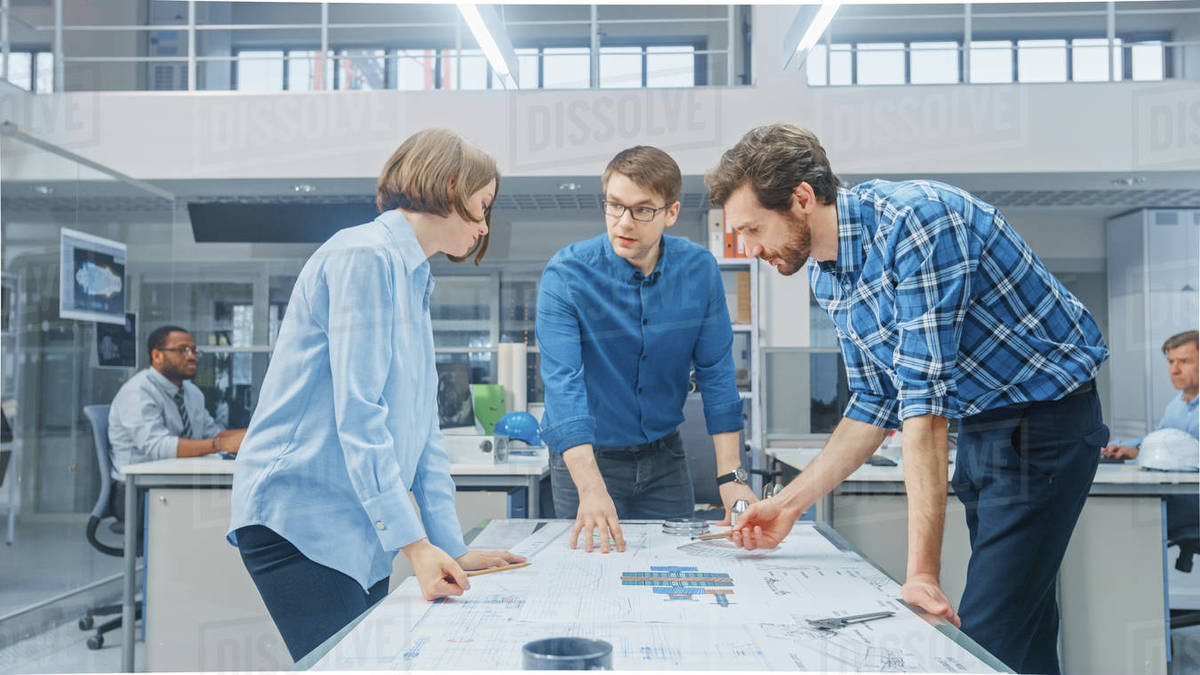 In the Industrial Engineering Facility: Female Designer Works with ...