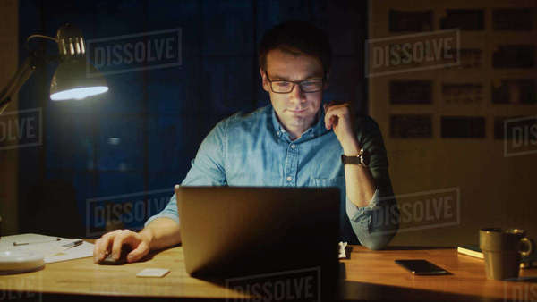 Professional Man Sitting at His Desk in Office Studio Working on a ...