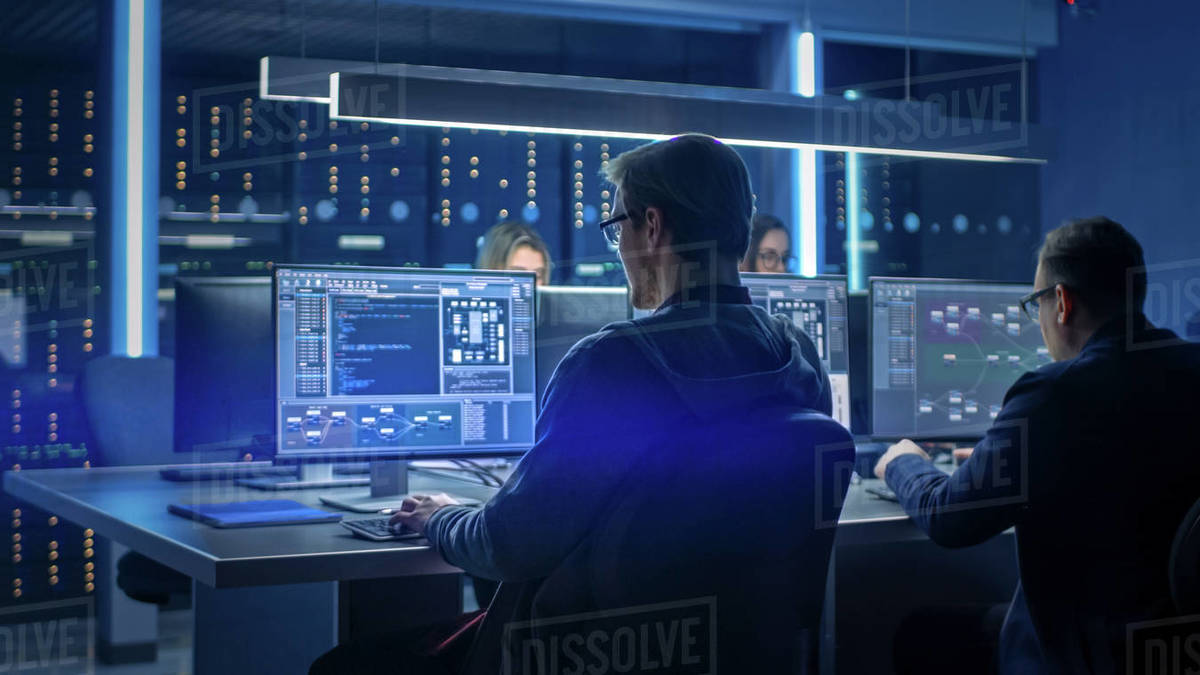 Team of IT Programers Working on Desktop Computers in Data Center ...