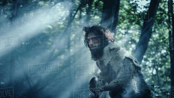 Primeval Caveman Wearing Animal Skin Holds Stone Tipped Spear Looks ...