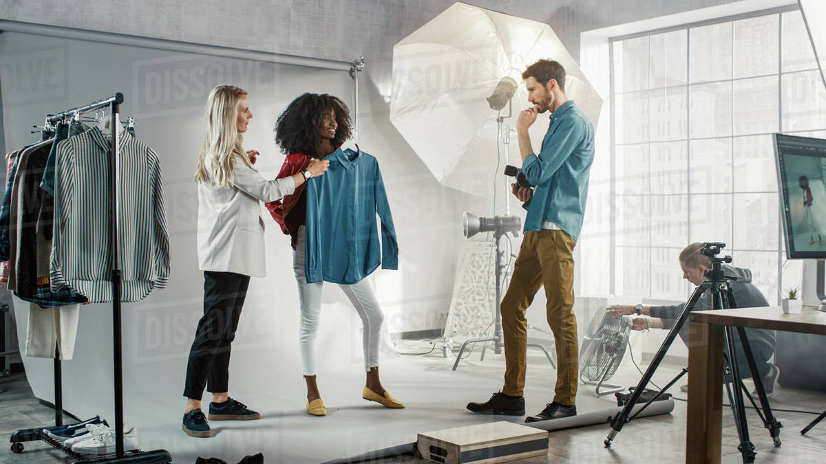 Backstage of the Photo Shoot: Stylist Chooses Outfit and Clothes for a ...