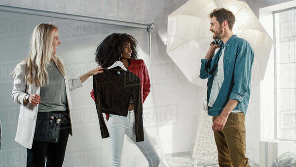 Backstage of the Photo Shoot: Stylist Chooses Outfit and Clothes for a ...