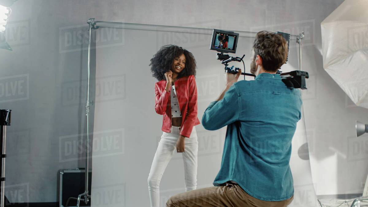 Beautiful Black Model Posing for a Video Clip, Cameraman Filming Her ...
