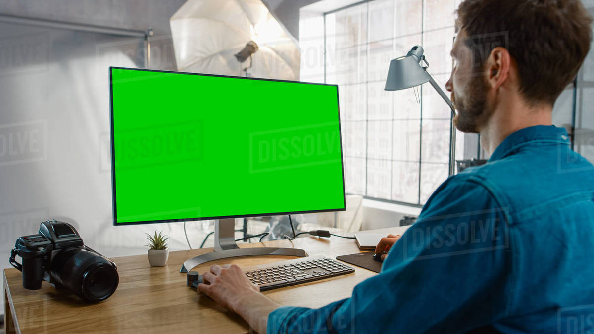 Backstage of the Photoshoot: Photo Editor Works on Desktop Computer ...