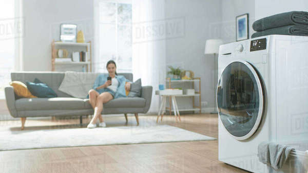 Shot of a Modern Technologically Advanced Washing Machine Working in a ...