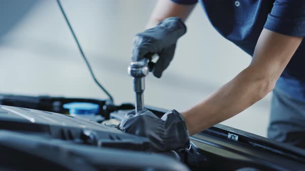 Slow Motion Close Up Footage of a Female Mechanic Working on a Vehicle ...