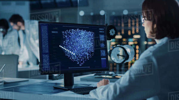 Over the Shoulder Shot: Female IT Scientist Uses Computer Showing ...