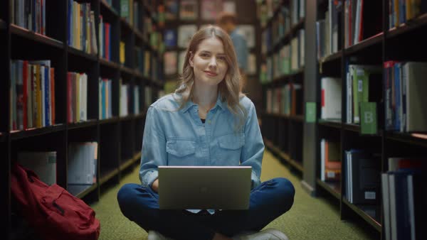 University Library Study: Smart Beautiful Caucasian Girl Sitting Cross ...