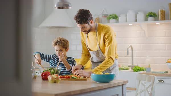 In Kitchen: Father and Cute Little Boy Cooking Together Healthy Dinner ...