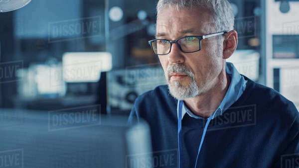 Portrait of Handsome Middle Aged Engineer Wearing Glasses Works on ...