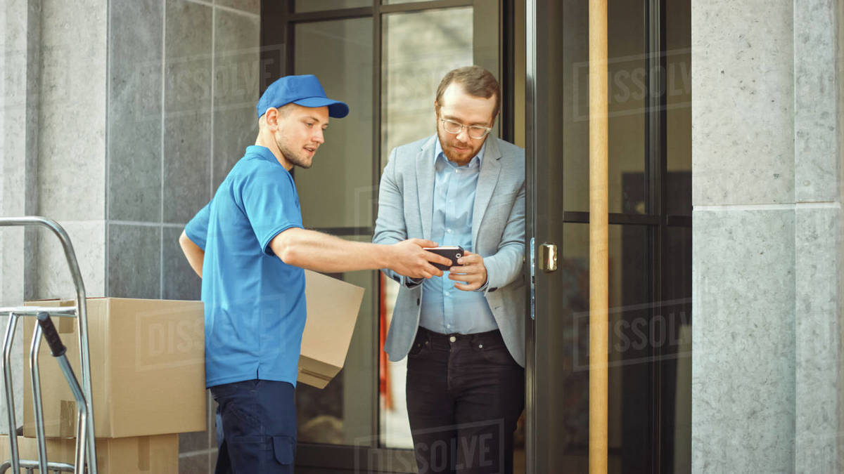 Delivery Man Gives Postal Package to a Business Customer, Who Signs ...