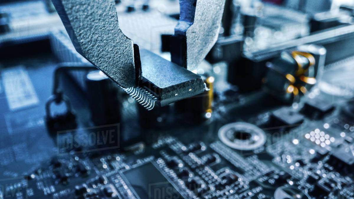Macro Close-up Shot of Factory Machine at Work: Printed Circuit Board ...