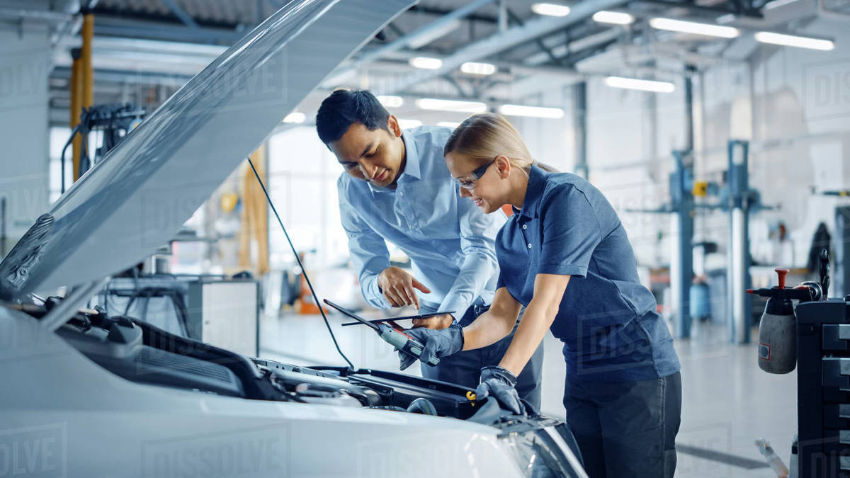 Instructor with a Tablet Computer is Giving a Task for a Future ...