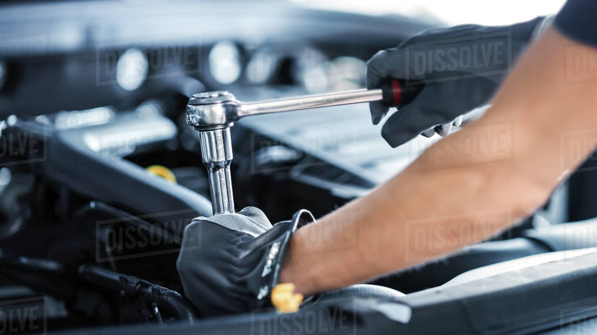 Close Up Shot of a Professional Mechanic Working on Vehicle in Car ...