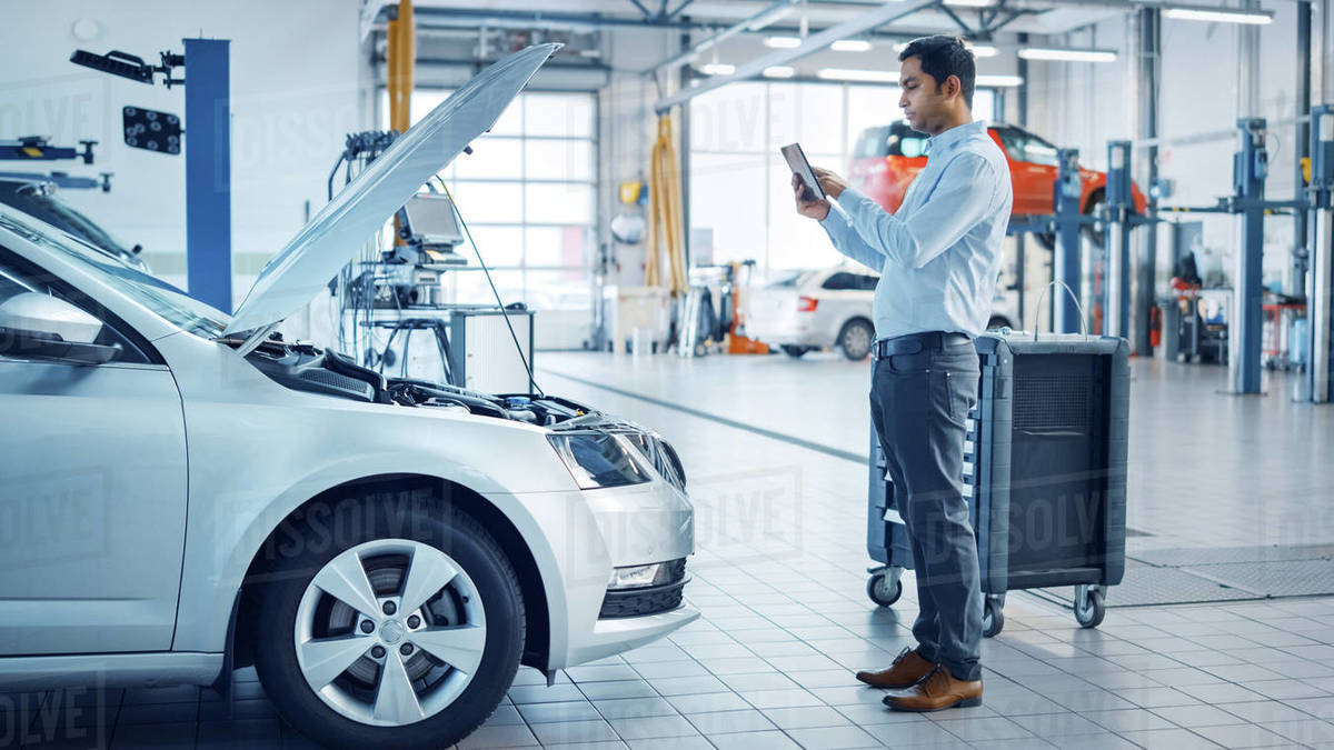 Car Service Manager Uses a Tablet Computer with an Augmented Reality ...