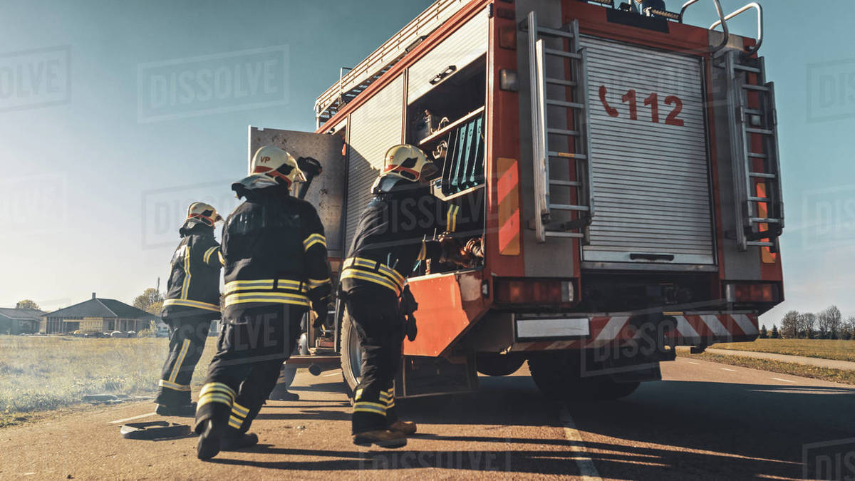 Rescue Team of Firefighters Arrive on the Car Crash Traffic Accident ...