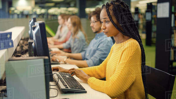 University Library: Gifted Beautiful Girl using Computer for Class ...