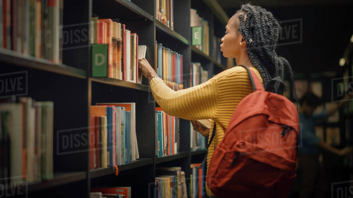 University Library: Portrait of Gifted Beautiful Girl Stands Between ...