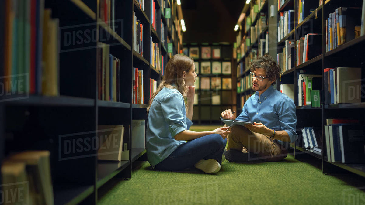University Library Study: Smart Girl Sitting and Talented Boy Sitting ...