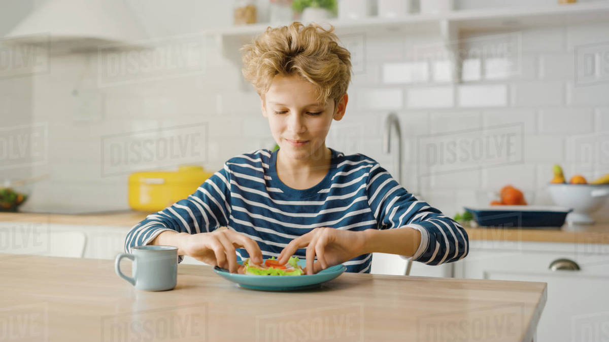 Portrait of the Cute Little Boy Started to Eat Sandwich at the Kitchen ...
