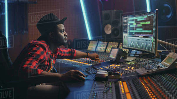 Stylish Audio Engineer Working in Music Recording Studio, Uses Mixing ...