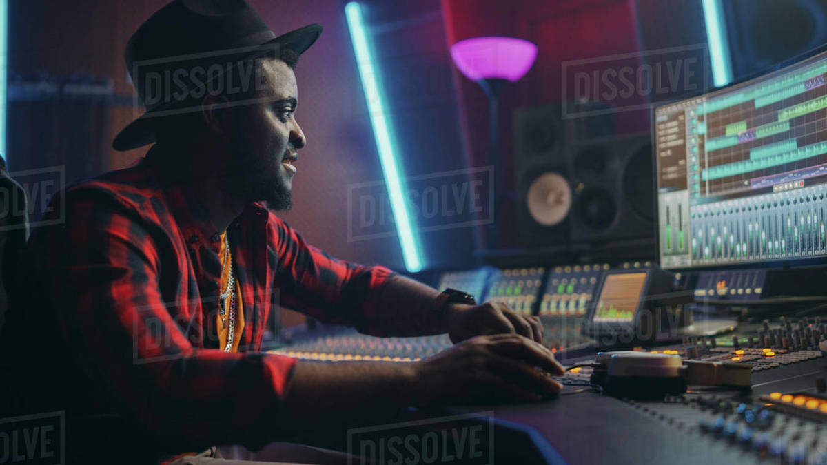 Stylish Male Audio Engineer Working in Music Recording Studio, Uses ...