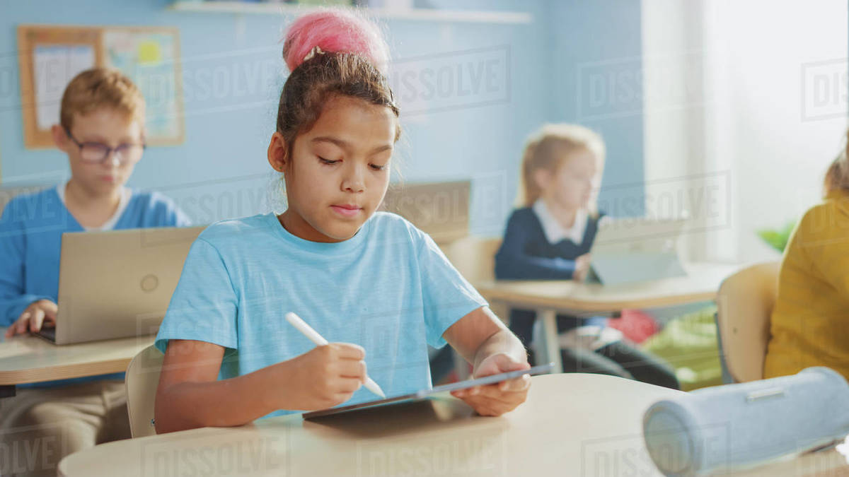 Elementary School Computer Science Class: Cute Girl Uses Digital Tablet ...