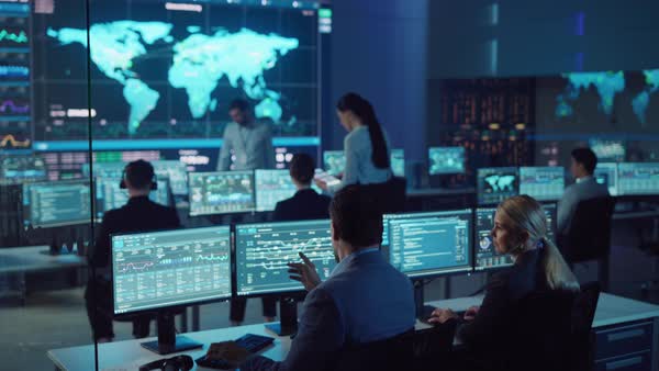 Team of Professional Computer Data Science Engineers Work on Desktops ...