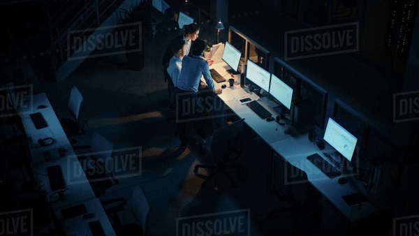 Late at Night In Modern Office: Diverse Team of Successful Businessmen ...