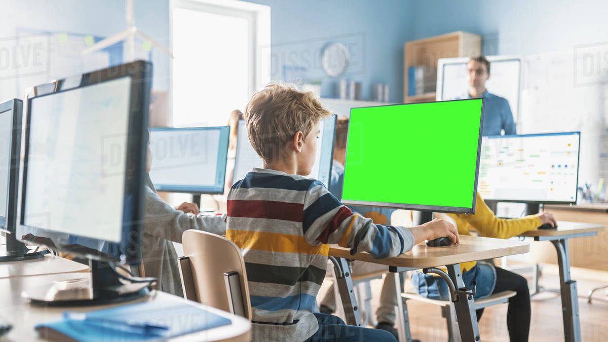 Elementary School Computer Science Classroom: Cute Little Boy Uses ...