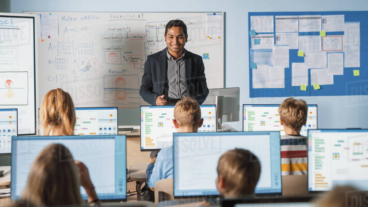 Elementary School Computer Science Class: Teacher Uses Digital Tablet ...