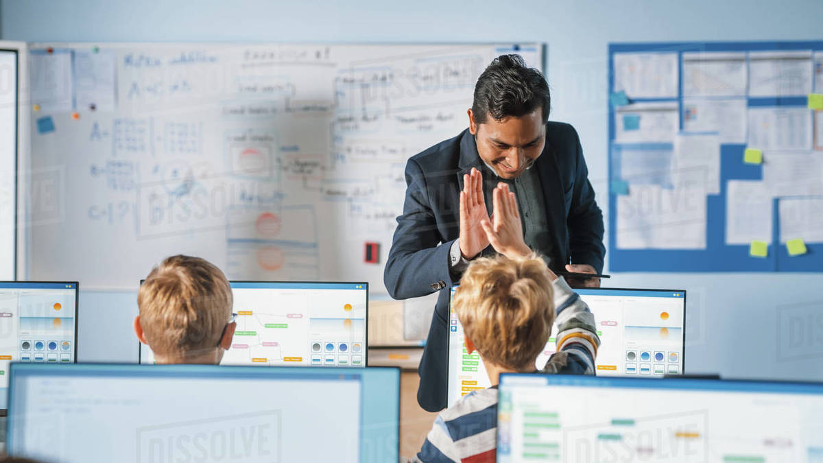 Elementary School Computer Science Classroom: Teacher Uses Tablet ...