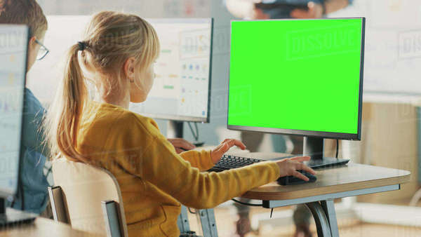Elementary School Computer Science Classroom: Cute Little Girl Uses ...