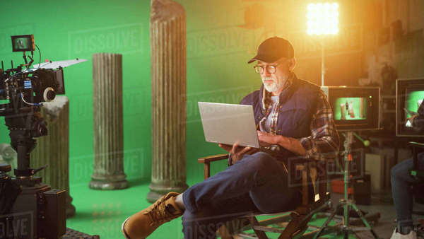 Prominent Successful Director Sitting in a Chair on a Break Using ...