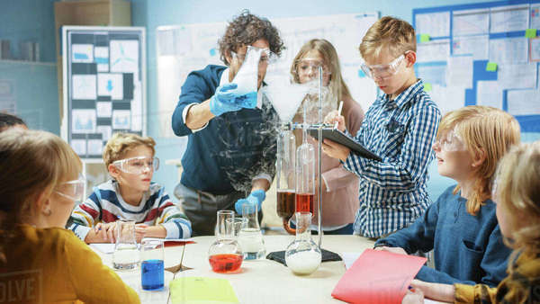 Elementary School Science Classroom: Enthusiastic Teacher Explains ...