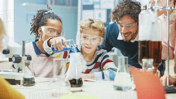 Elementary School Science Classroom: Little Boy Mixes Chemicals in ...