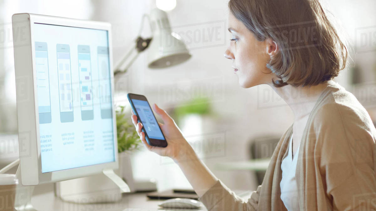 Beautiful Female Software Developer Compares Her Smartphone App with ...