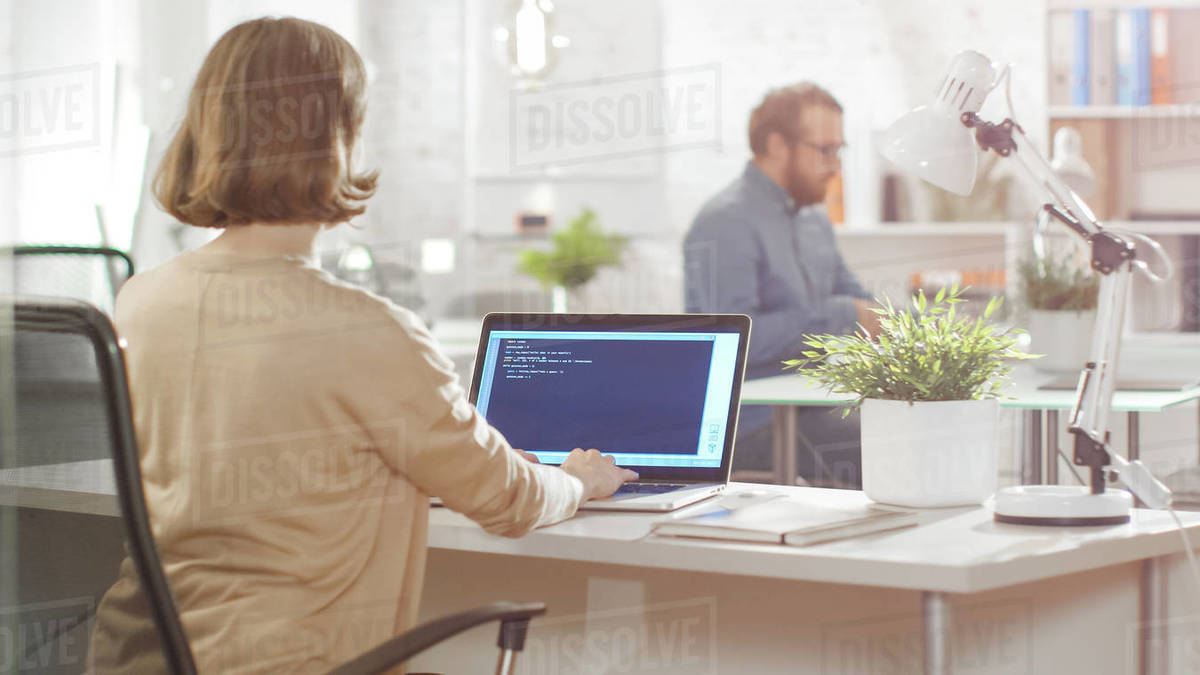 Young Creative Woman Software Developer Writes Code on Her Laptop ...