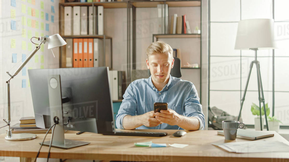 Creative Entrepreneur Sitting at His Desk Works on Desktop Computer in ...